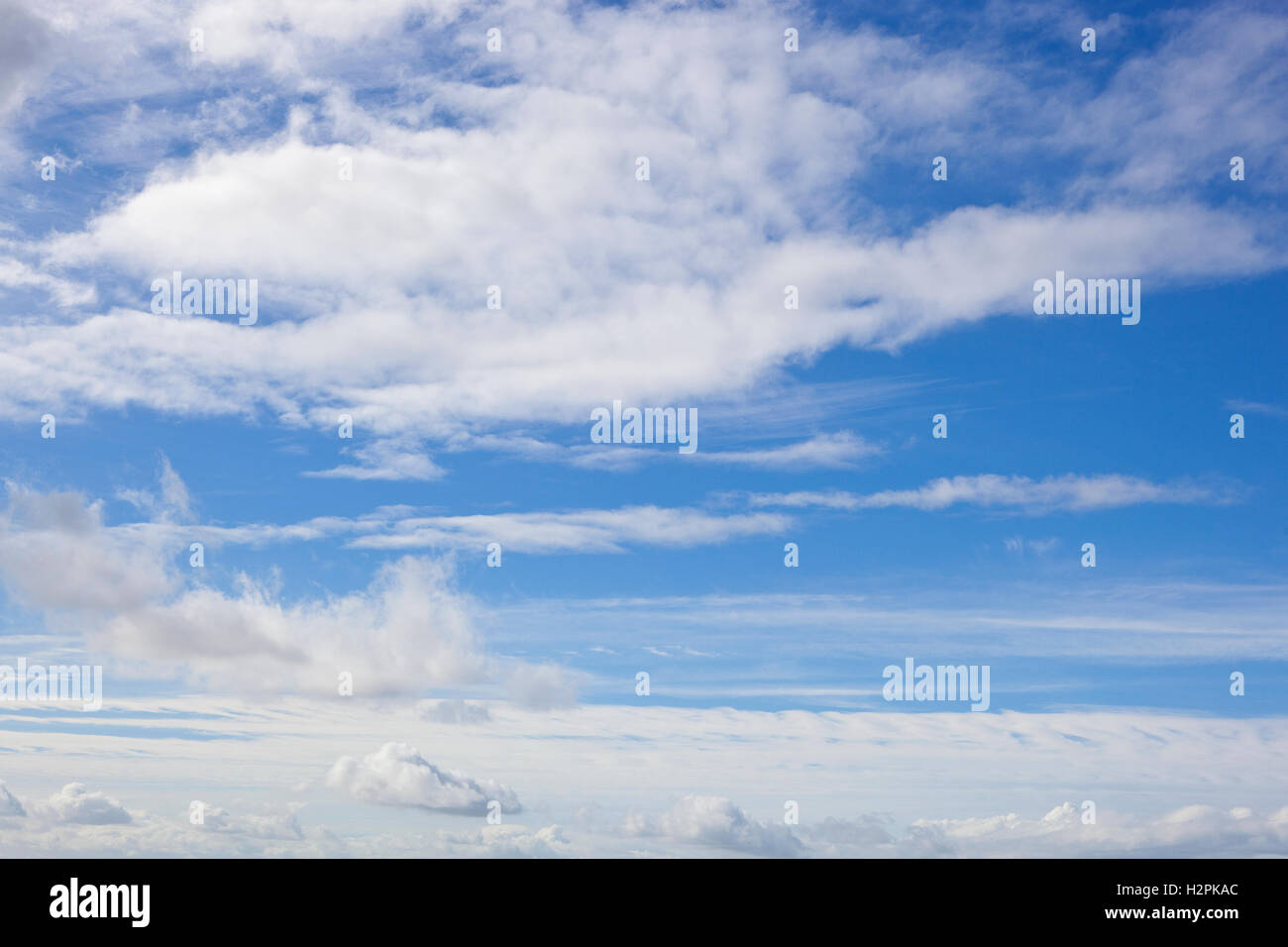 Background image of a blue sky with fluffy white clouds Stock Photo - Alamy