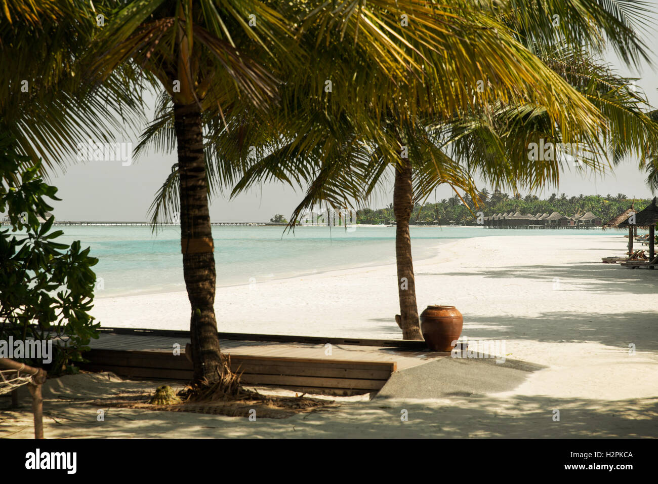 bungalow huts in sea water on exotic resort beach Stock Photo - Alamy