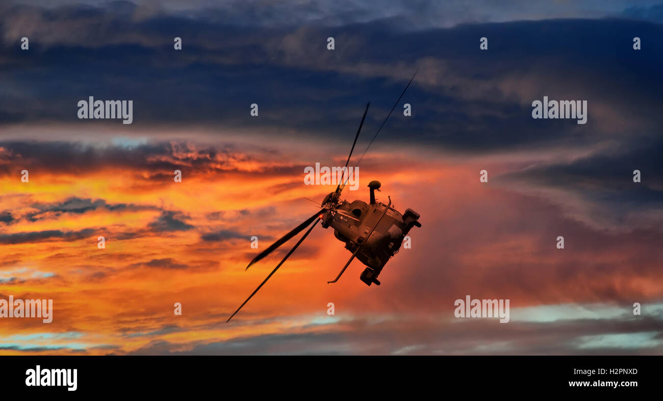 helicopter in the sky at sunset Stock Photo - Alamy
