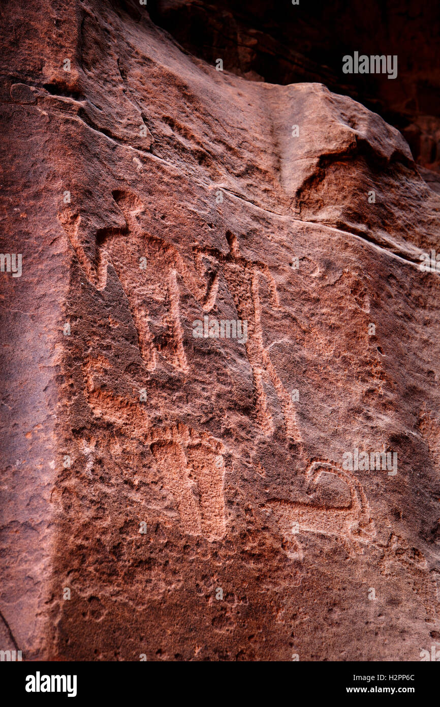 Petroglyphs in Khaz'ali Canyon walls depicting humans, footprints and ...