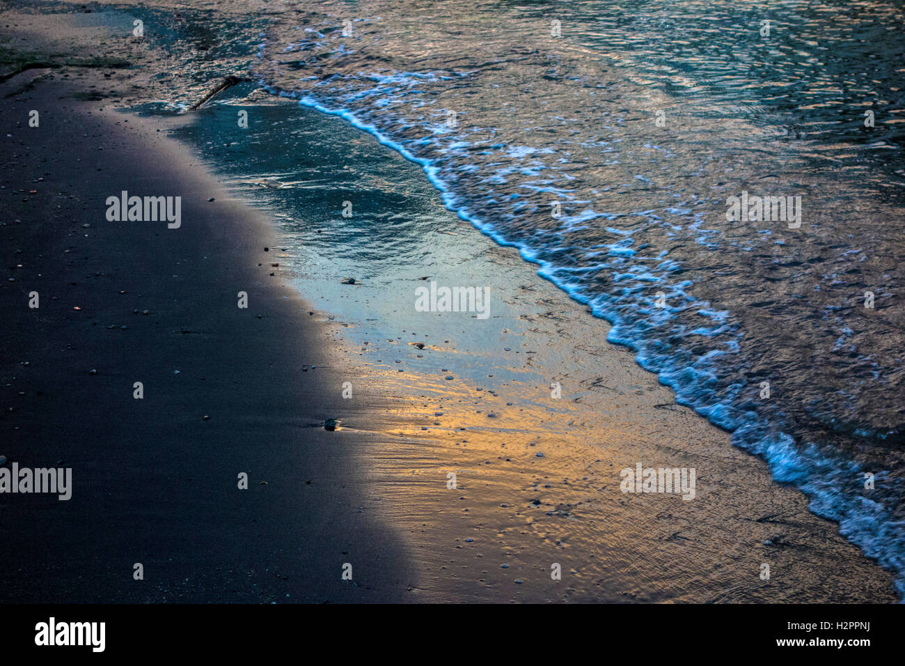 Volcanic beach sunset Stock Photo - Alamy