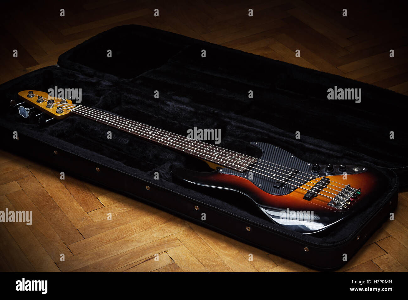 Jazz bass guitar in opened padded suitcase on parquet Stock Photo - Alamy