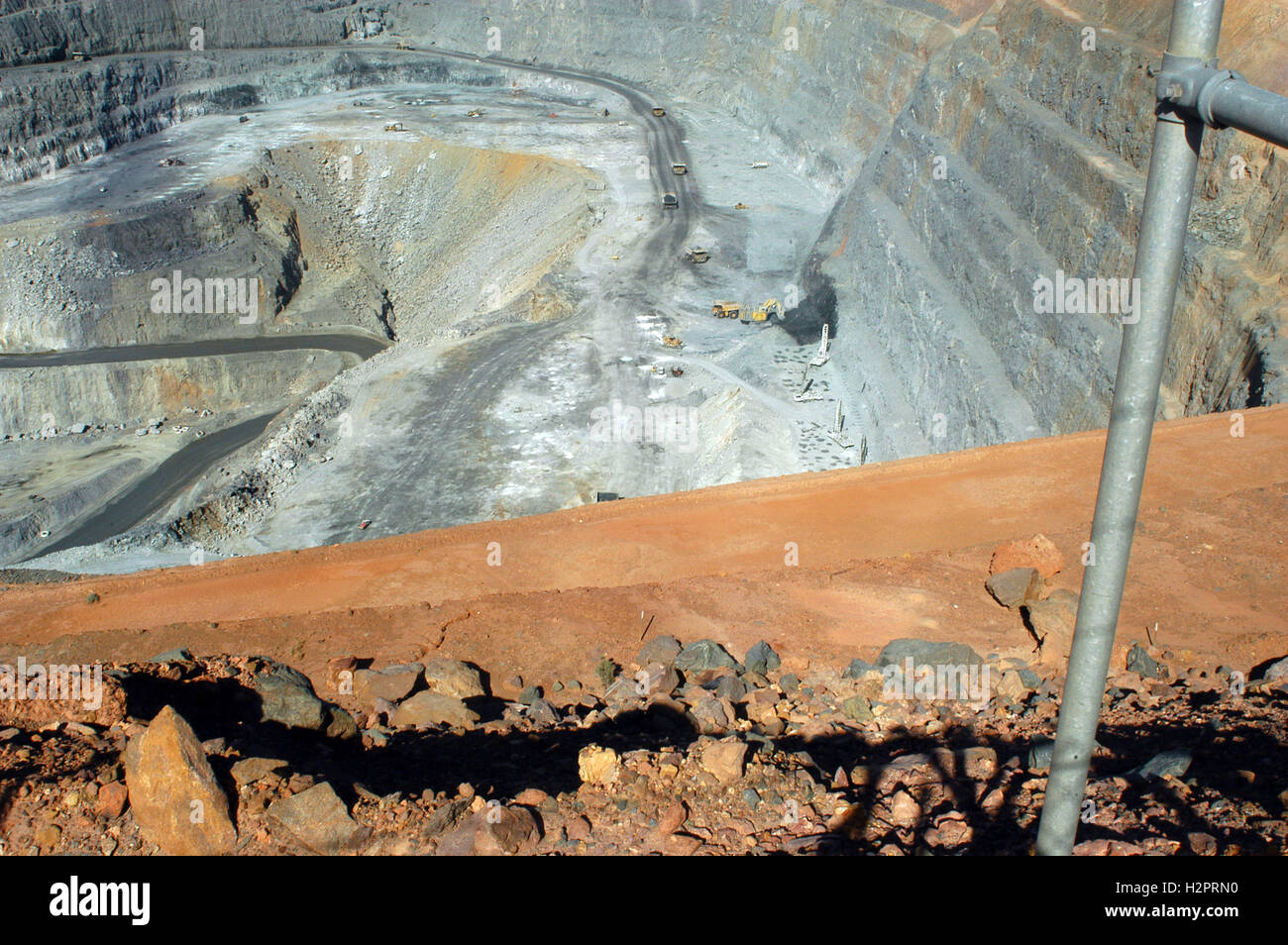 View inside the huge hole and big machines of the gold mine in ...