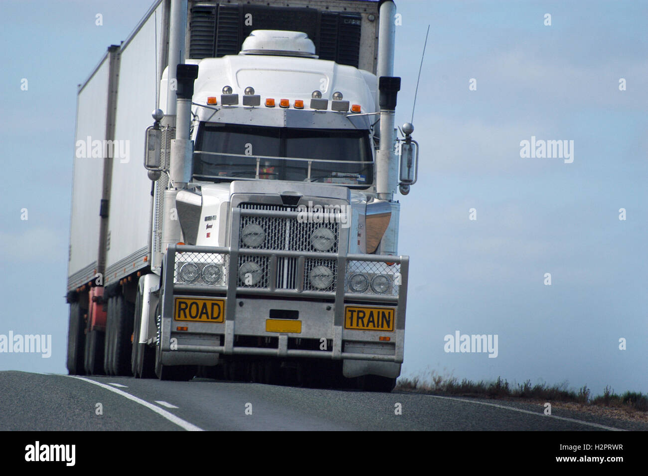 Big full speed truck on the road in Australia Stock Photo - Alamy