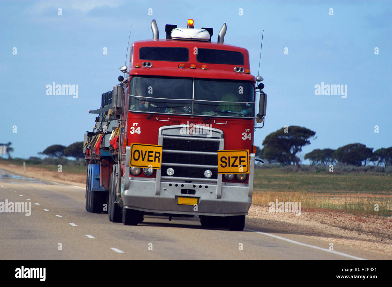 Big full speed truck on the road in Australia Stock Photo - Alamy
