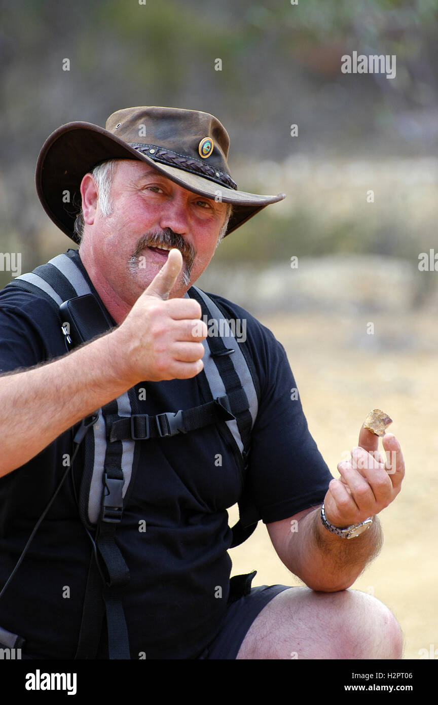 gold prospector in a Victorian forest in Australia at work with a metal ...