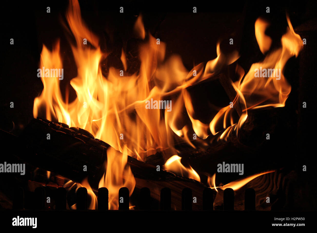 Fire in the fireplace background Stock Photo - Alamy