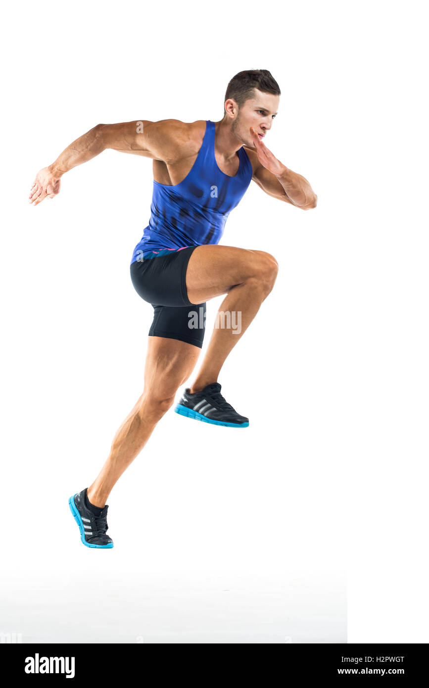 Full length portrait of a fitness man running isolated on a white ...