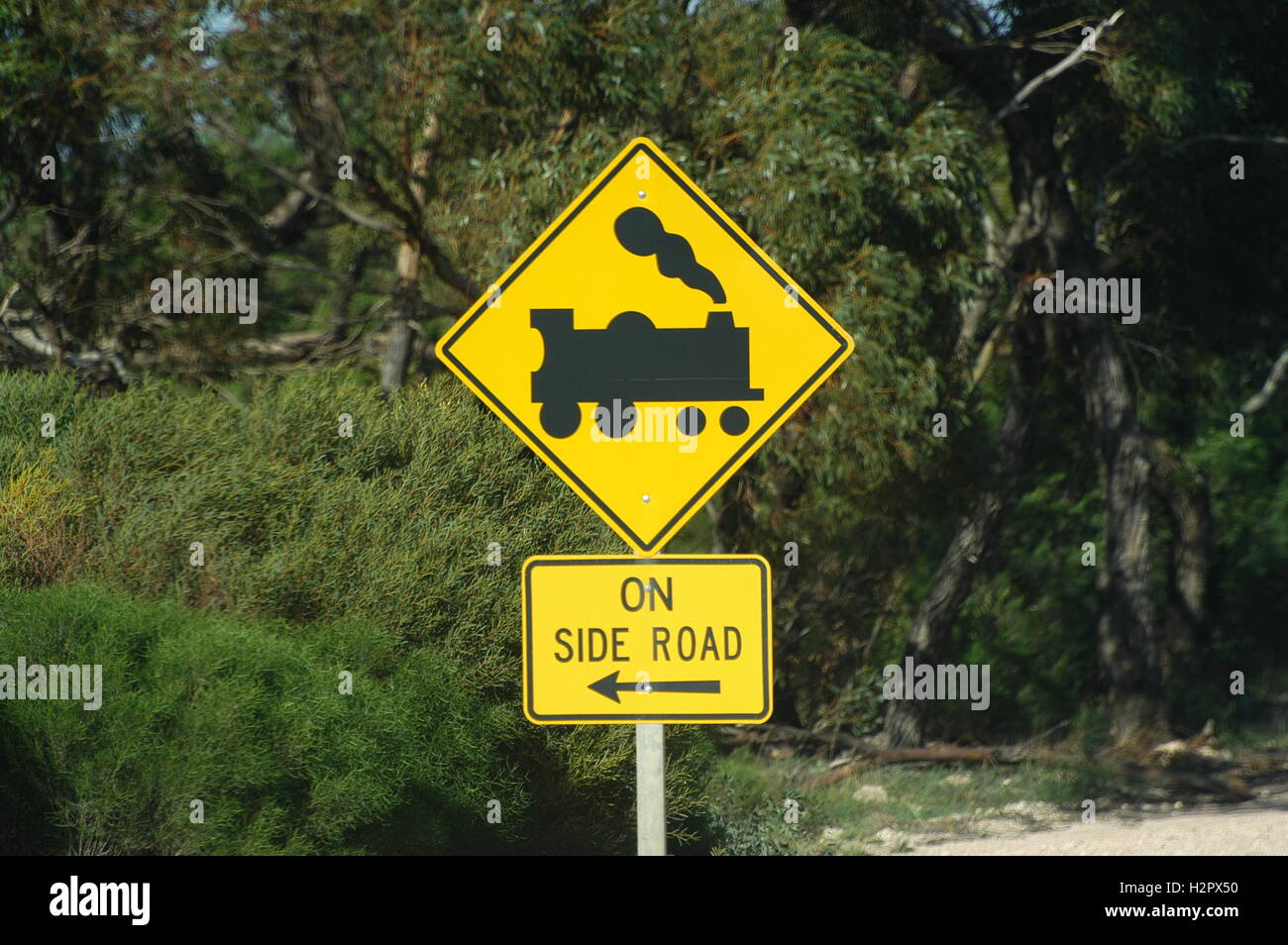 road sign indicating the possible passage of a train on the road in ...