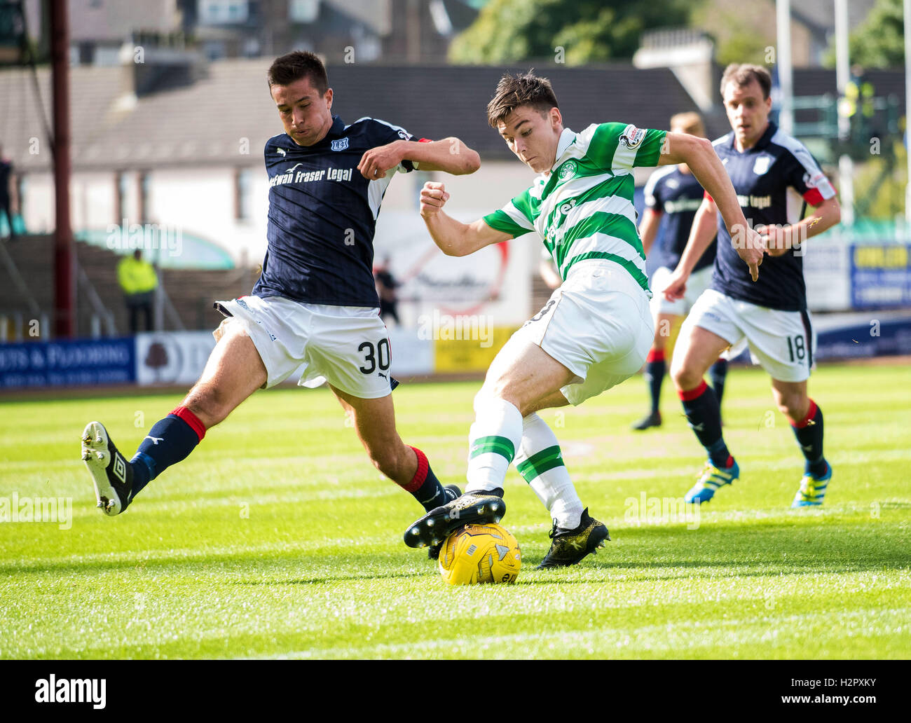 Dundee's Cammy Kerr and Celtic's Kieran Tierney (right) compete for the ...