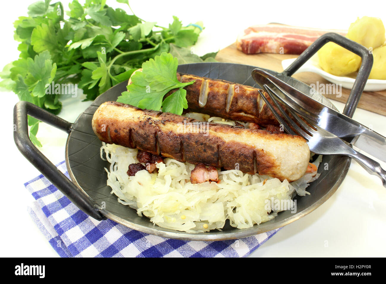 fried sausage with sourcrout Stock Photo - Alamy
