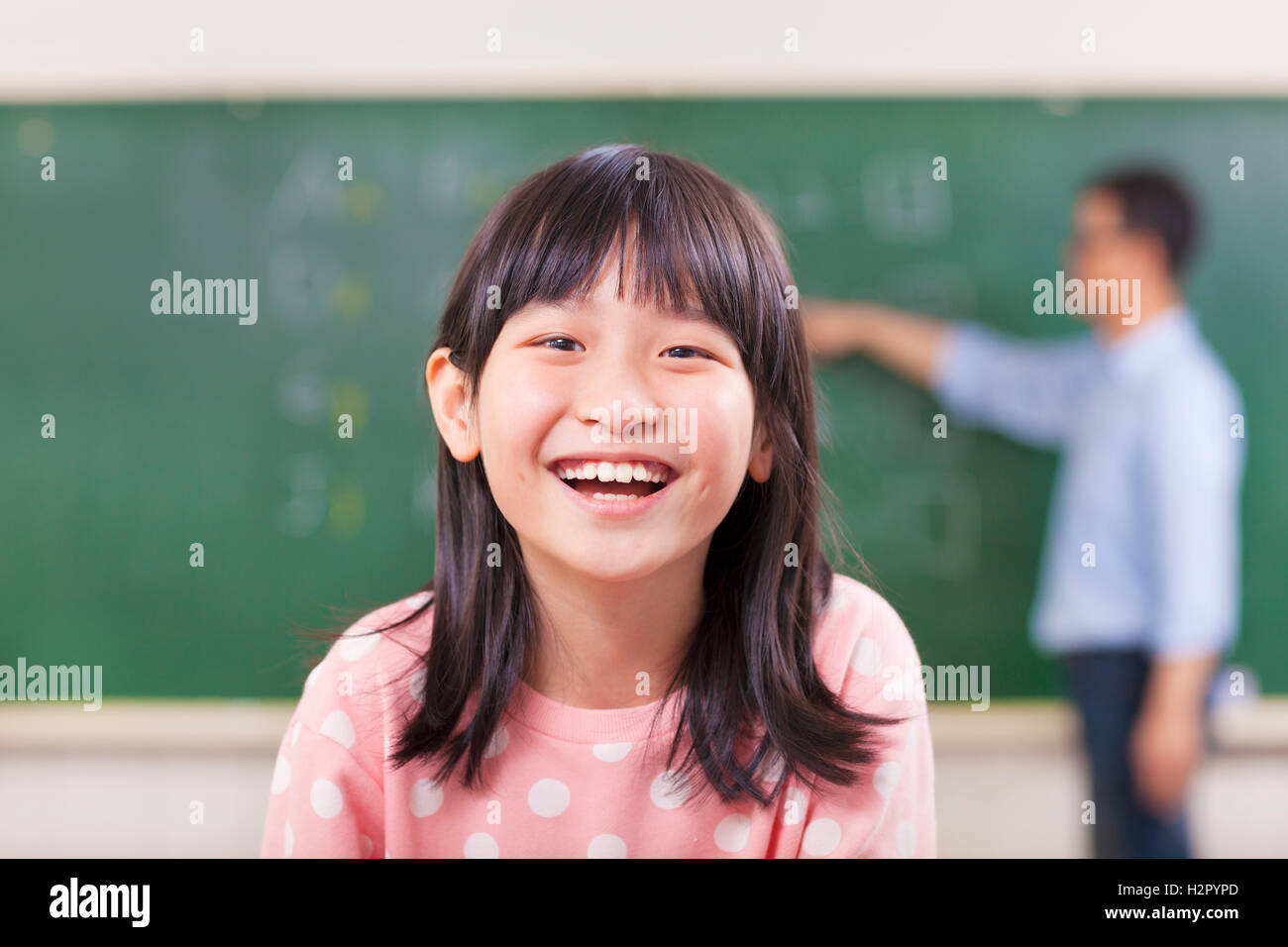 happy pupils smiling in class with teacher Stock Photo - Alamy