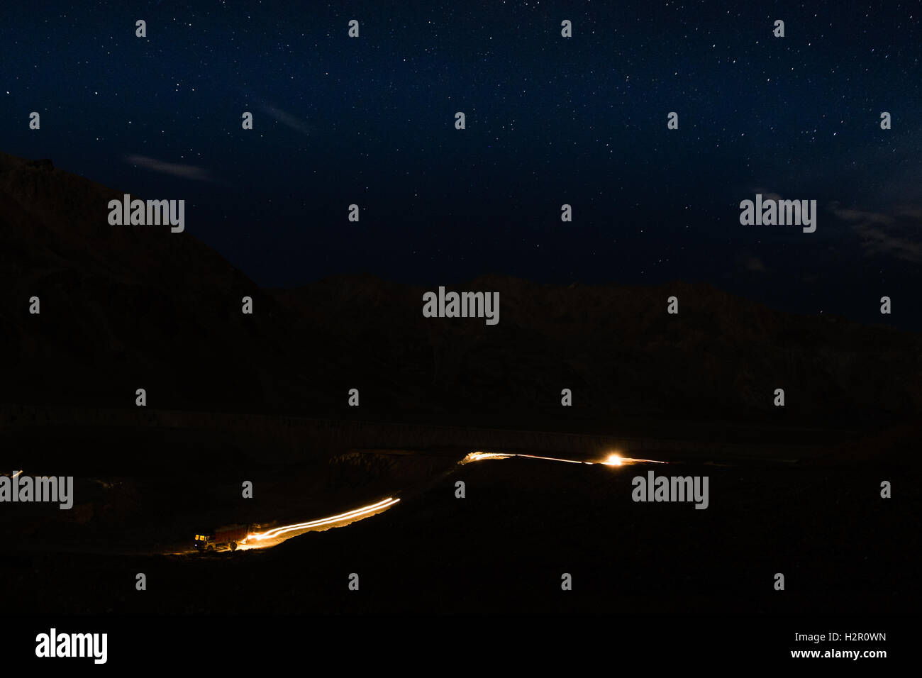 Trucks driving through the night under the stars on the Manali to Leh ...