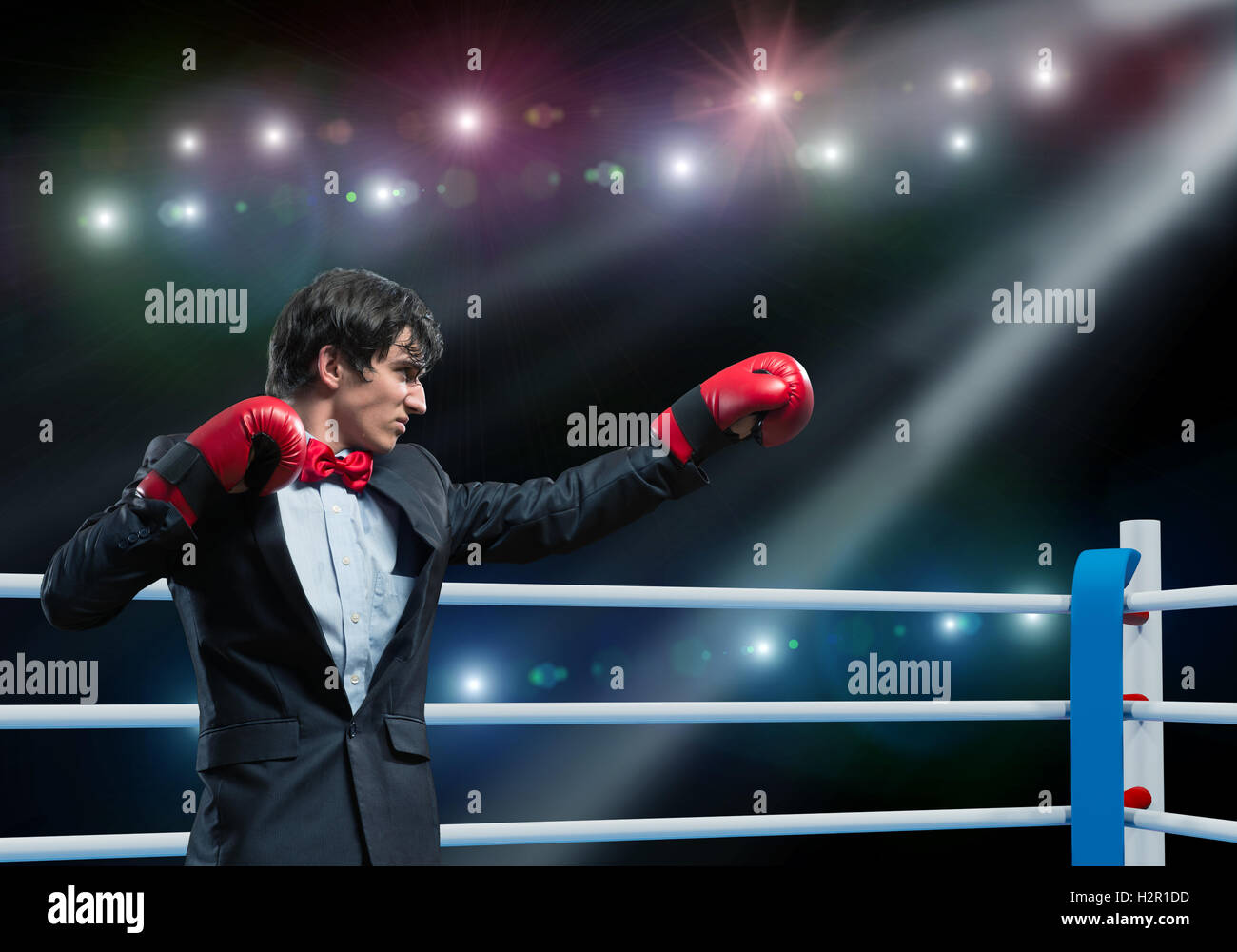 businessman with boxing gloves in the ring Stock Photo - Alamy