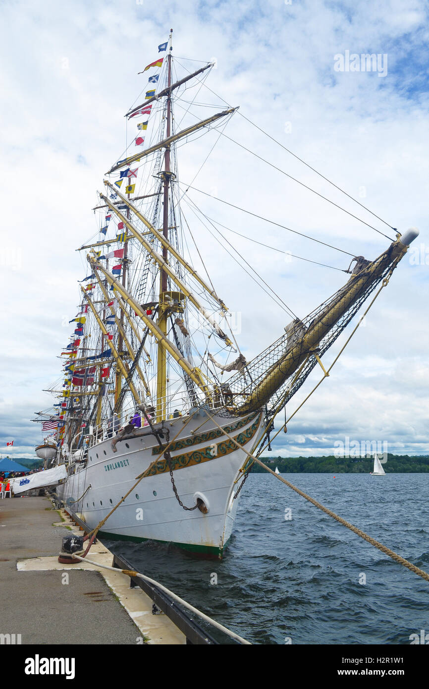 A big two mast tall ship under blue sky in the harbor of Hamilton ...