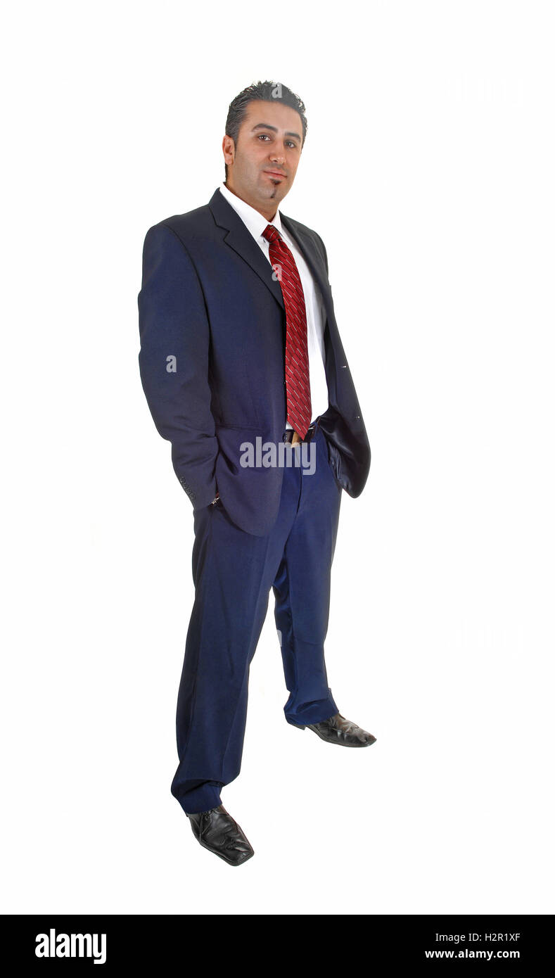 A tall handsome businessman standing for white background in a blue ...