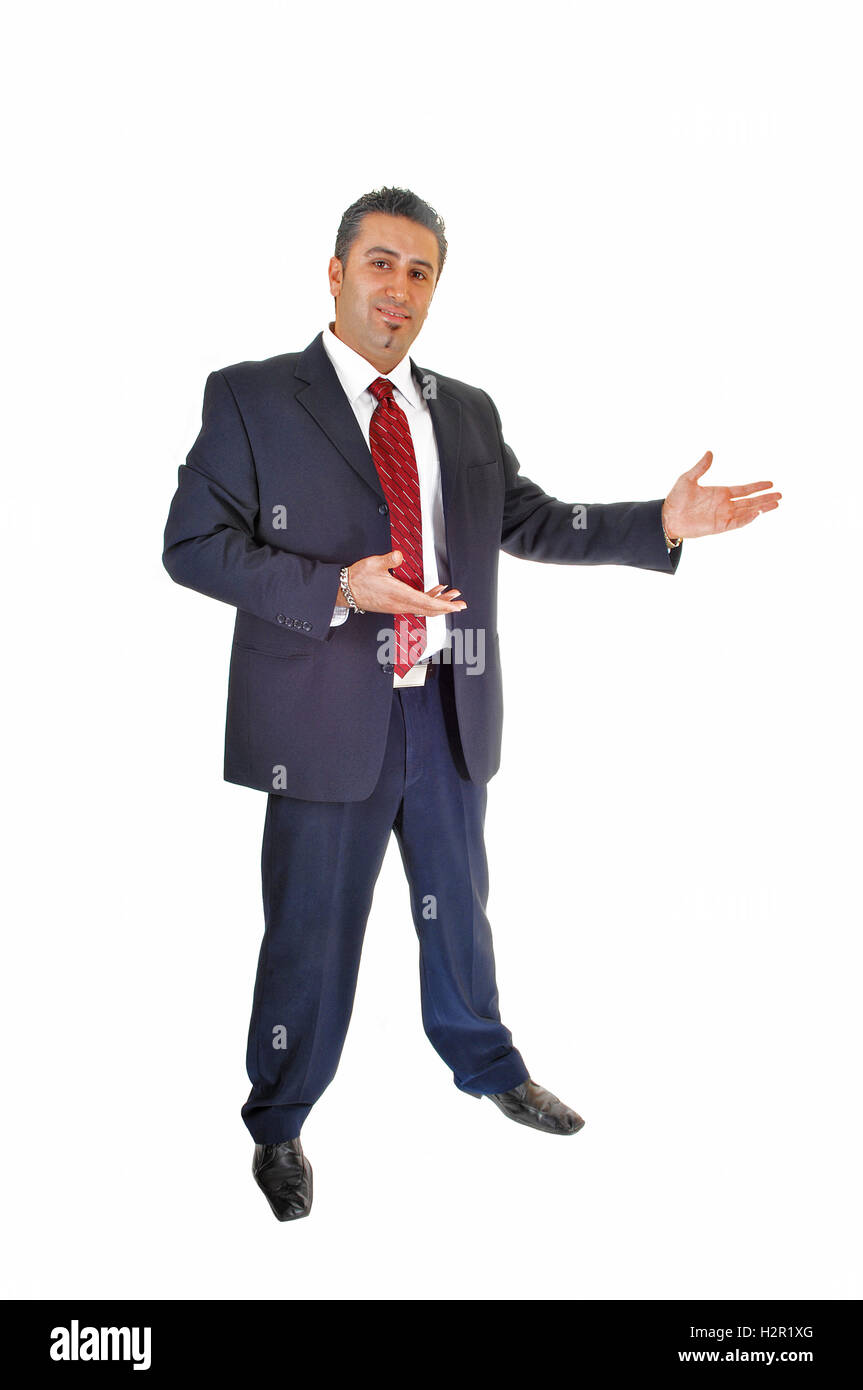A tall handsome businessman standing for white background in a blue ...