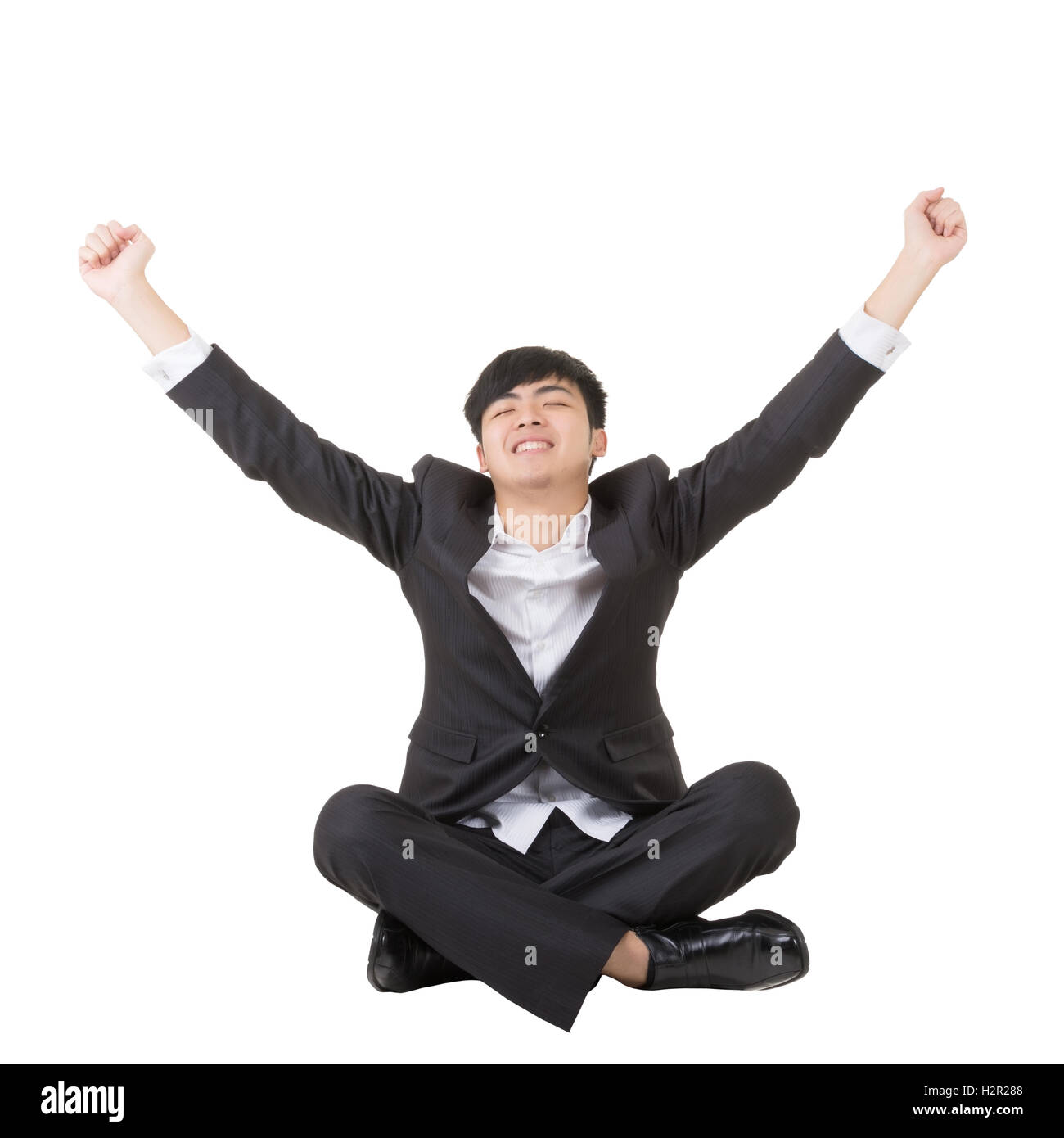 Young asian businessman sit and feel freedom Stock Photo - Alamy