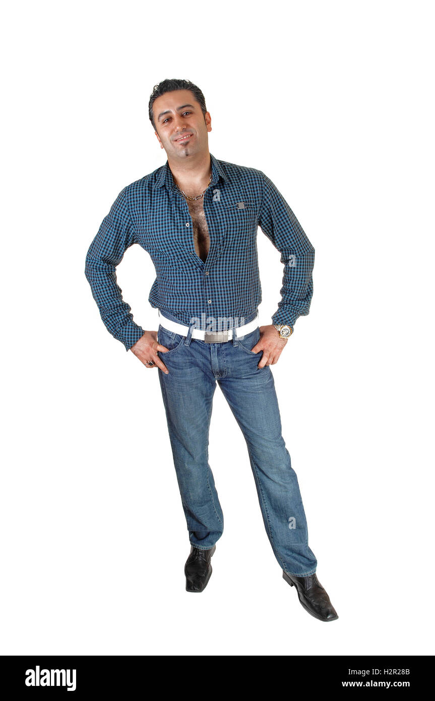 A young tall man standing for white background very relaxed with his ...