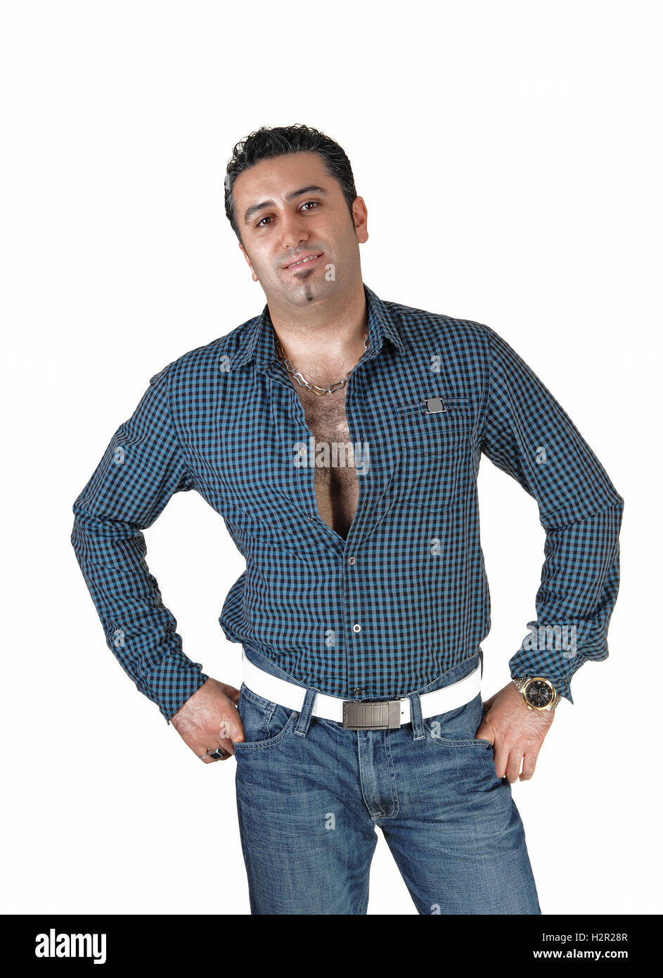 A young tall man standing for white background very relaxed with his ...
