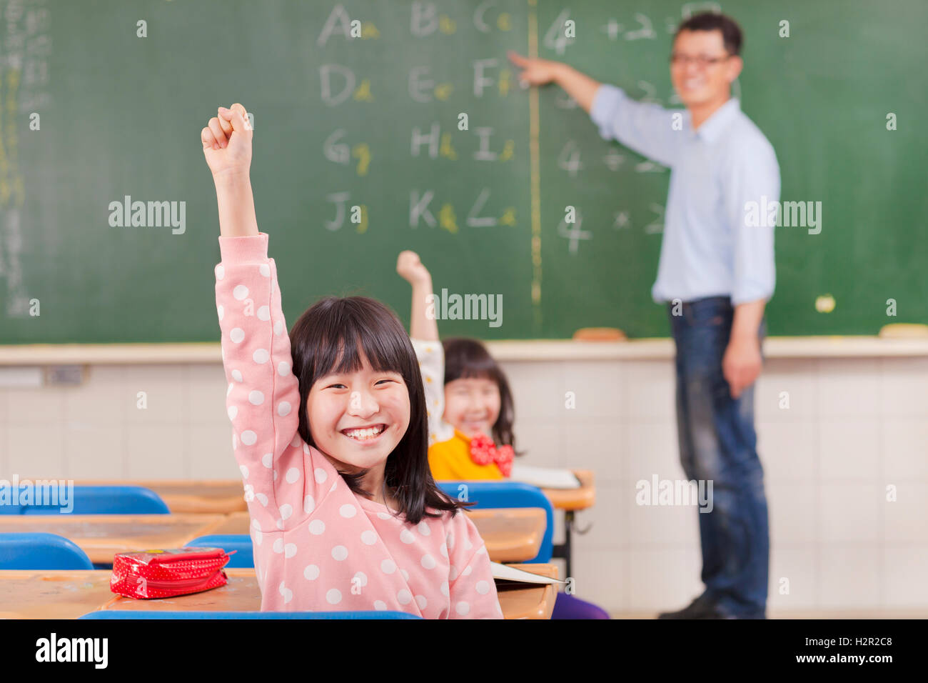 School children in classroom at lesson Stock Photo - Alamy