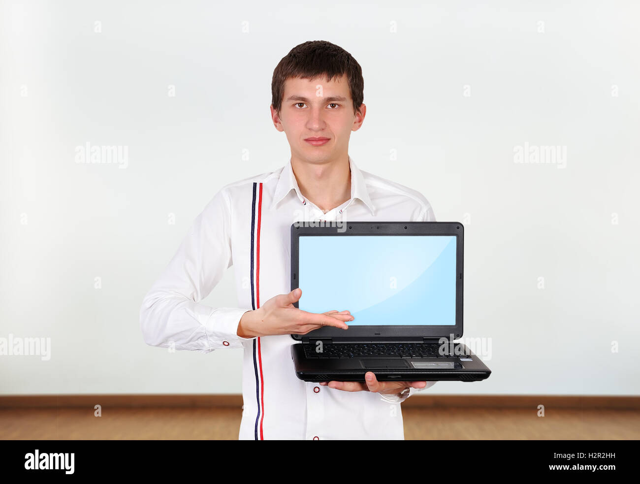 boy holding laptop Stock Photo - Alamy