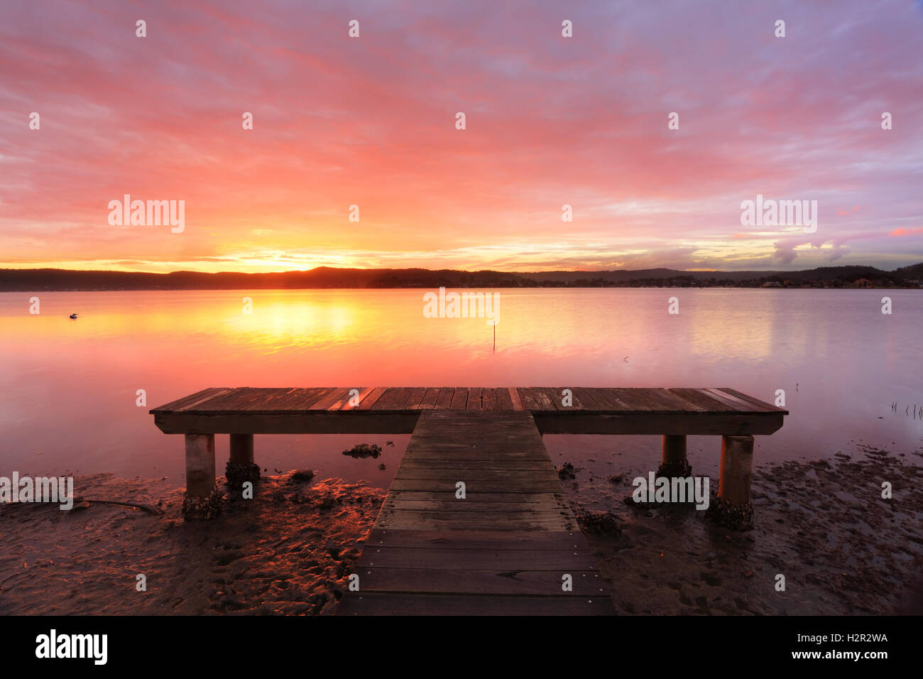 Australian sunset at Green Point jetty Australia Stock Photo - Alamy