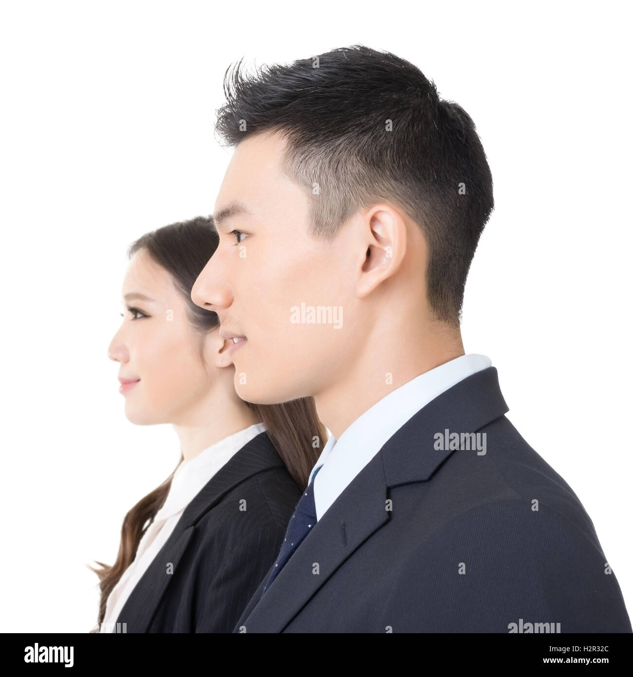 Side view of young business man and woman Stock Photo - Alamy