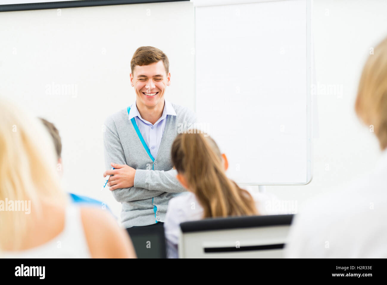 teacher talking with students Stock Photo - Alamy
