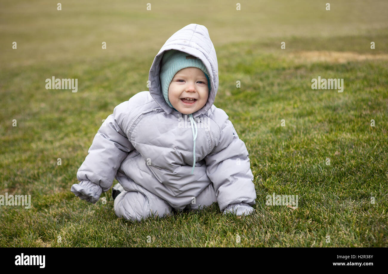 Cute little boy in a spring park Stock Photo - Alamy