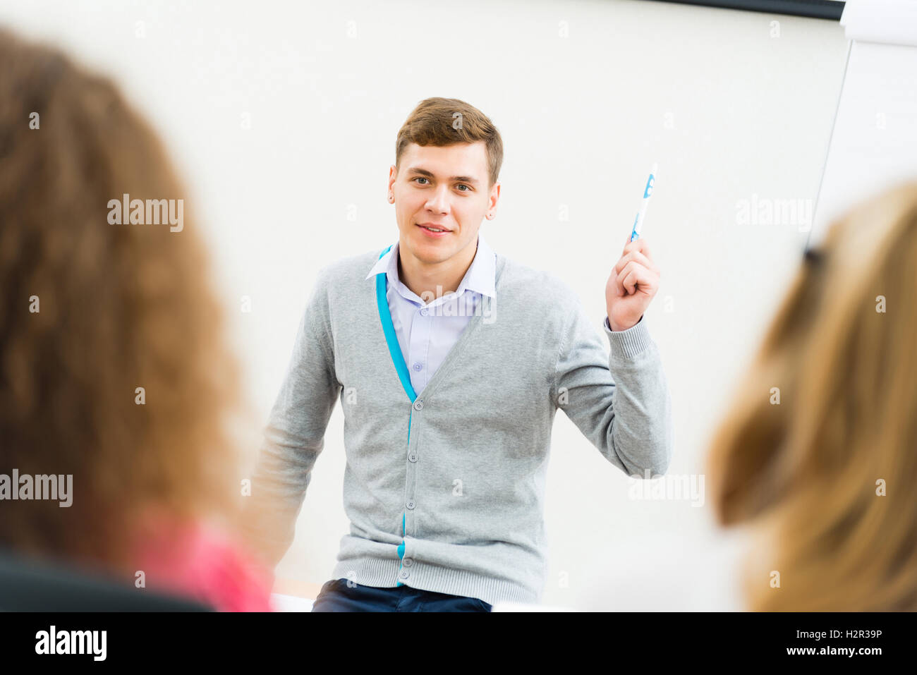 teacher talking with students Stock Photo - Alamy