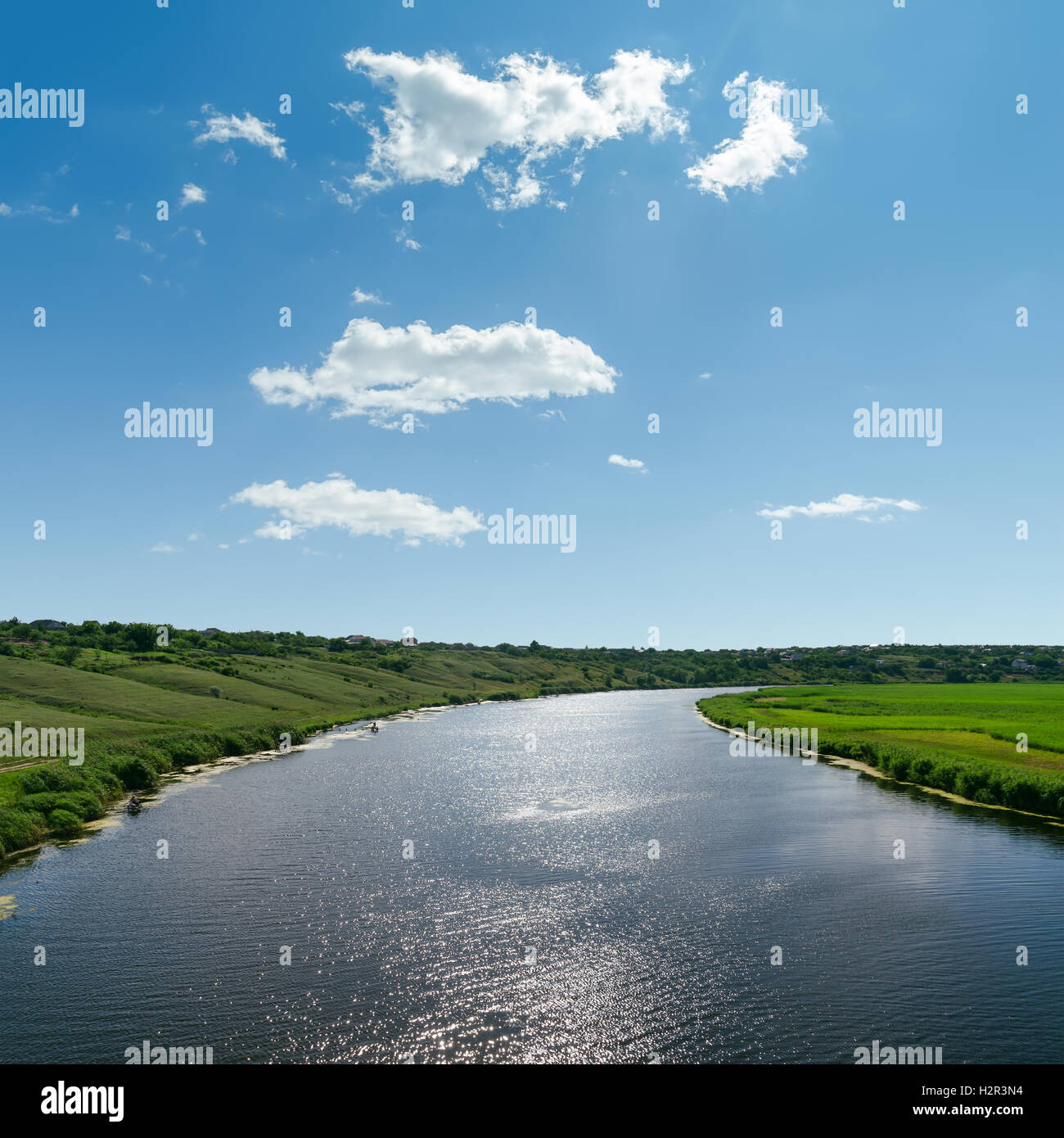 river with reflections and clouds in blue sky Stock Photo - Alamy
