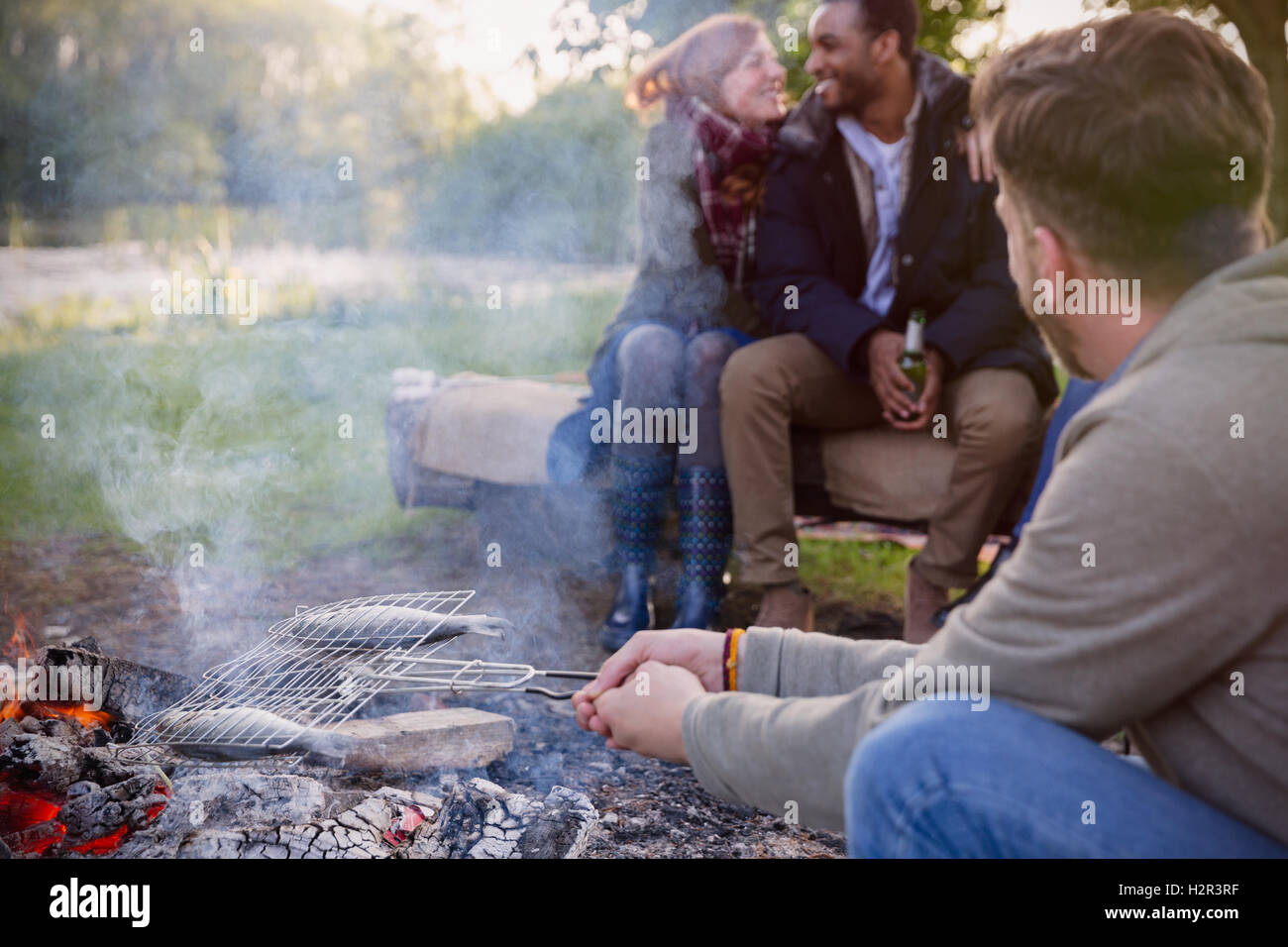 Woman cooking over grill hi-res stock photography and images - Alamy