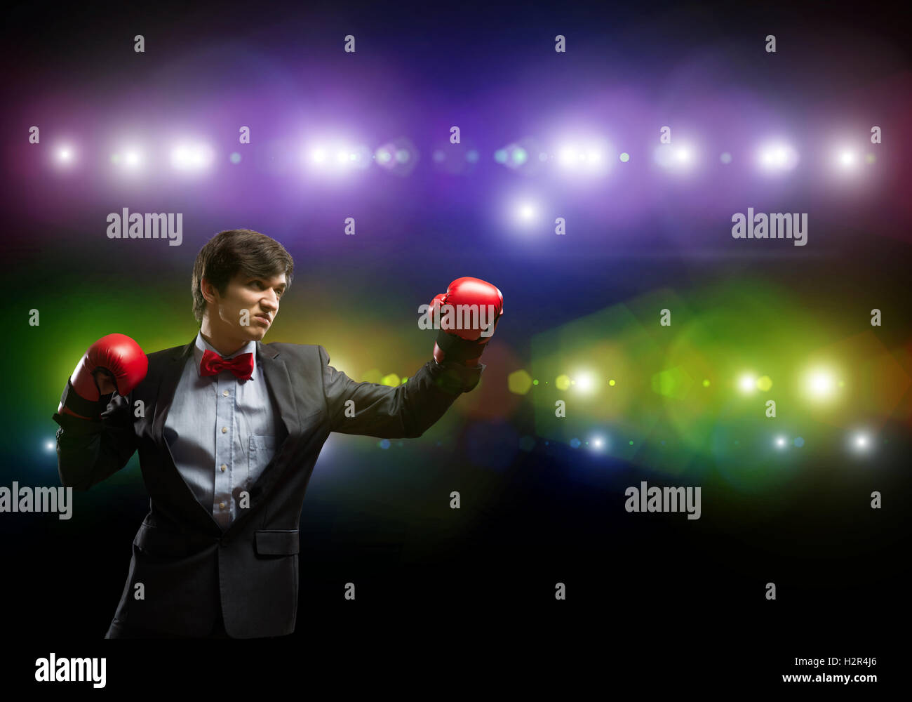 businessman with boxing gloves in the ring Stock Photo - Alamy