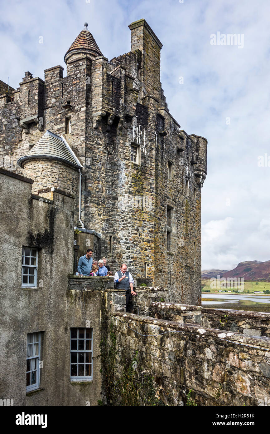Guide with tourists in the Eilean Donan Castle, Ross and Cromarty ...