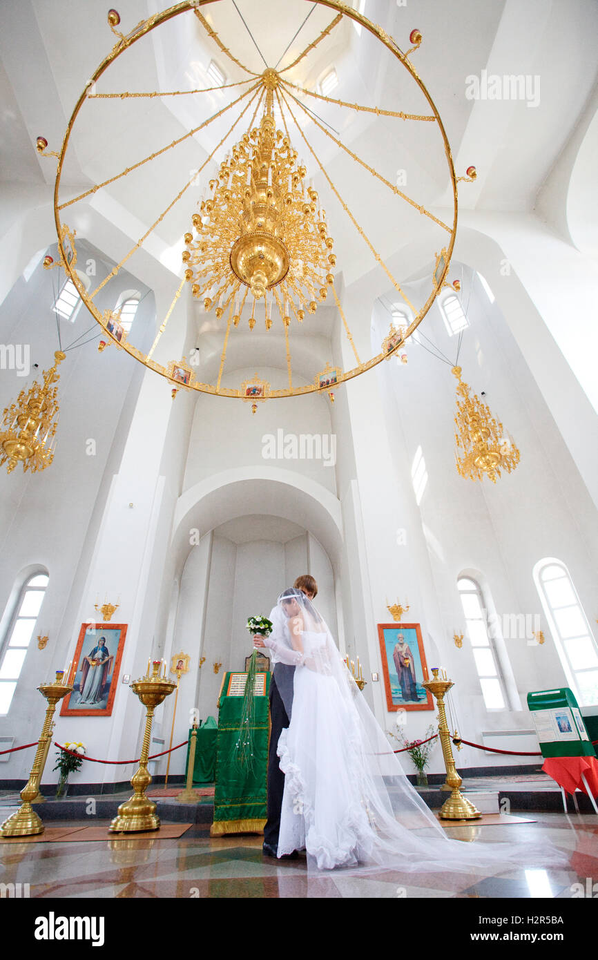 bride and groom in the church Stock Photo - Alamy