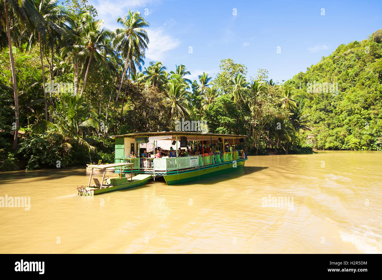 Exotic cruise boat with tourists on a jungle river Loboc, Bohol Stock ...