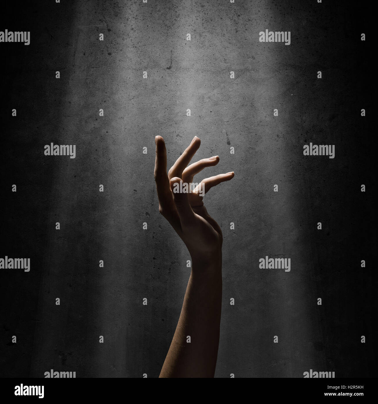 woman's hand reaches for the light rays Stock Photo - Alamy