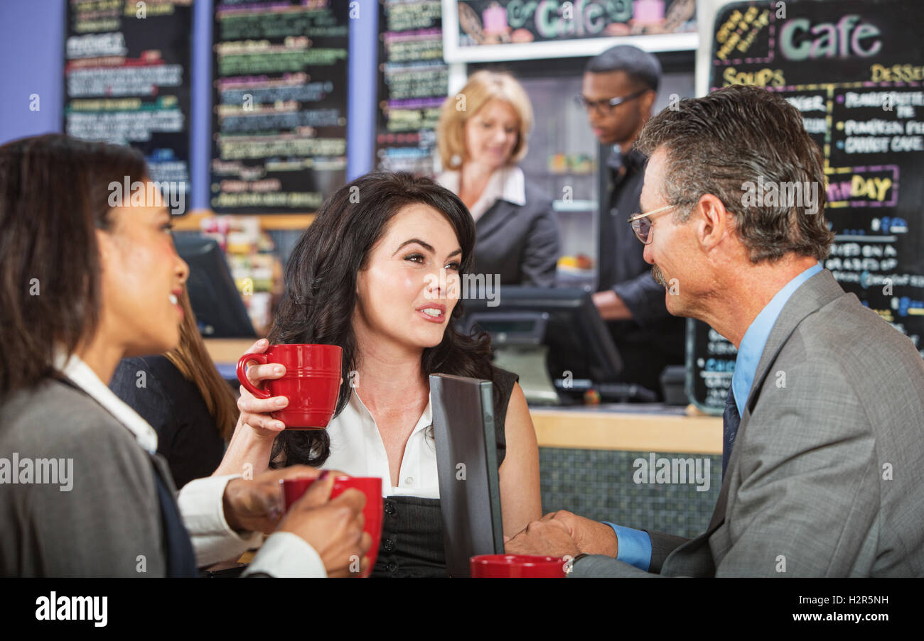 Mixed Group Talking in Cafe Stock Photo - Alamy