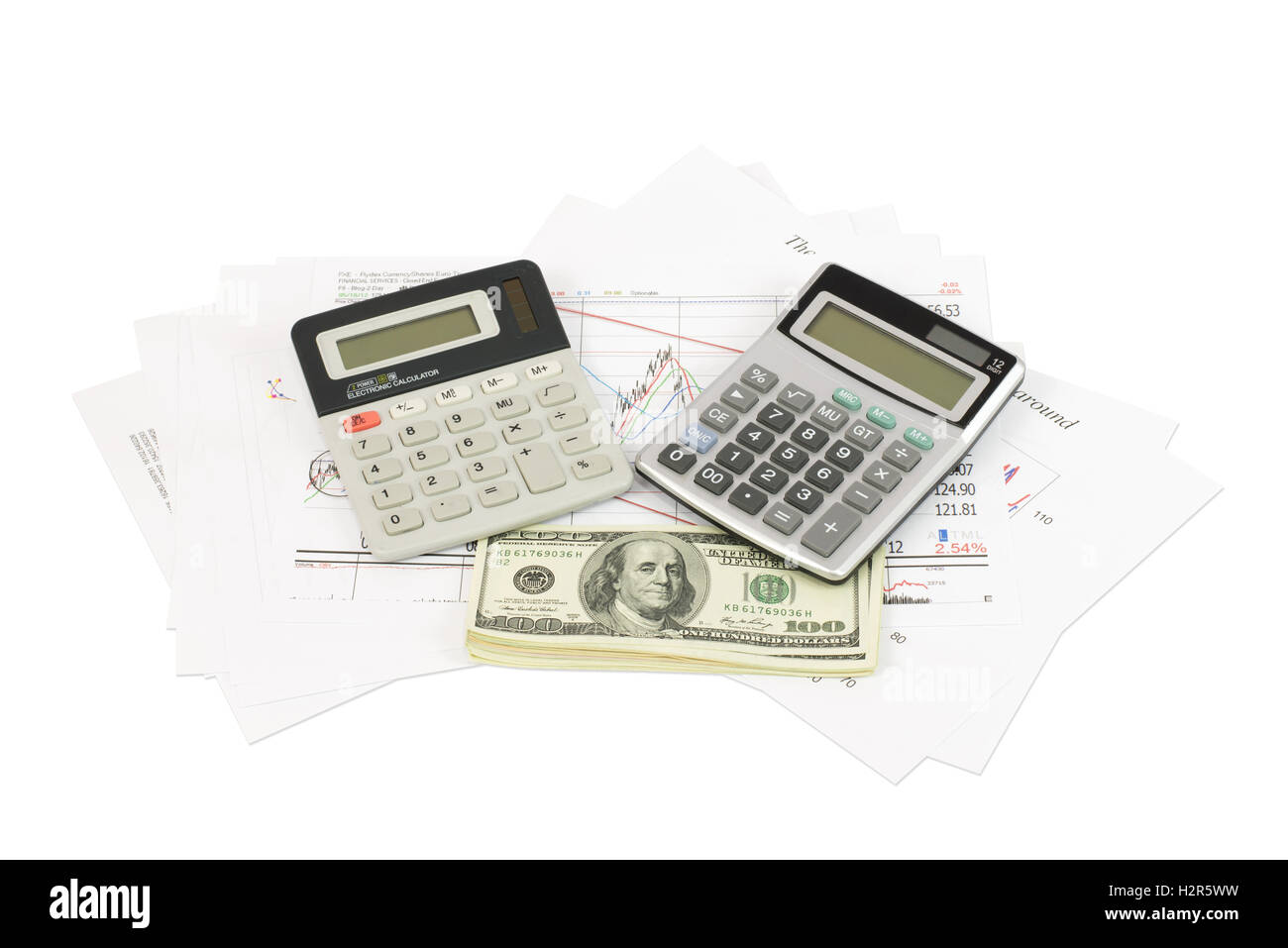 Dollars, calculator and paper charts Stock Photo - Alamy