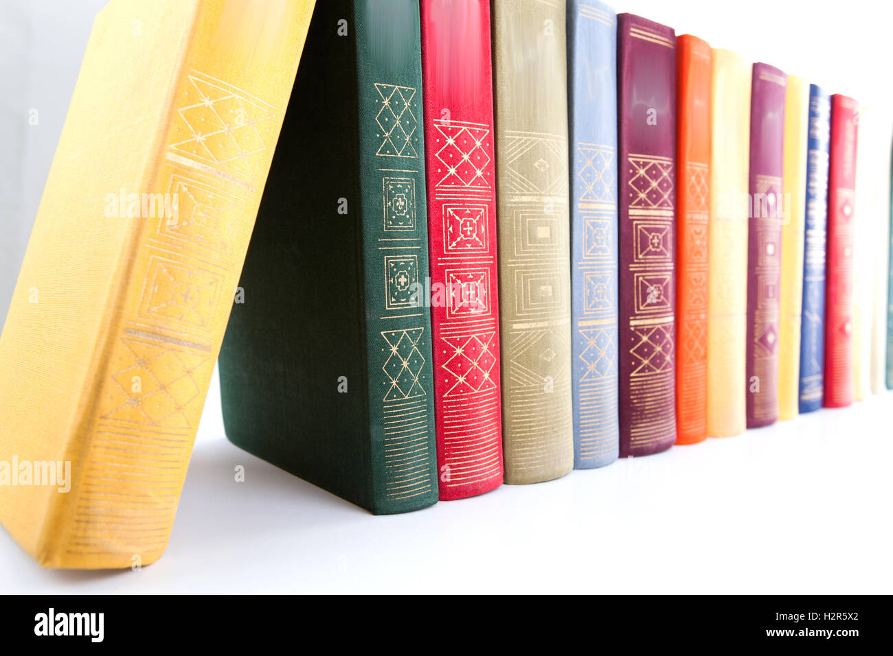 stack of books on white Stock Photo - Alamy