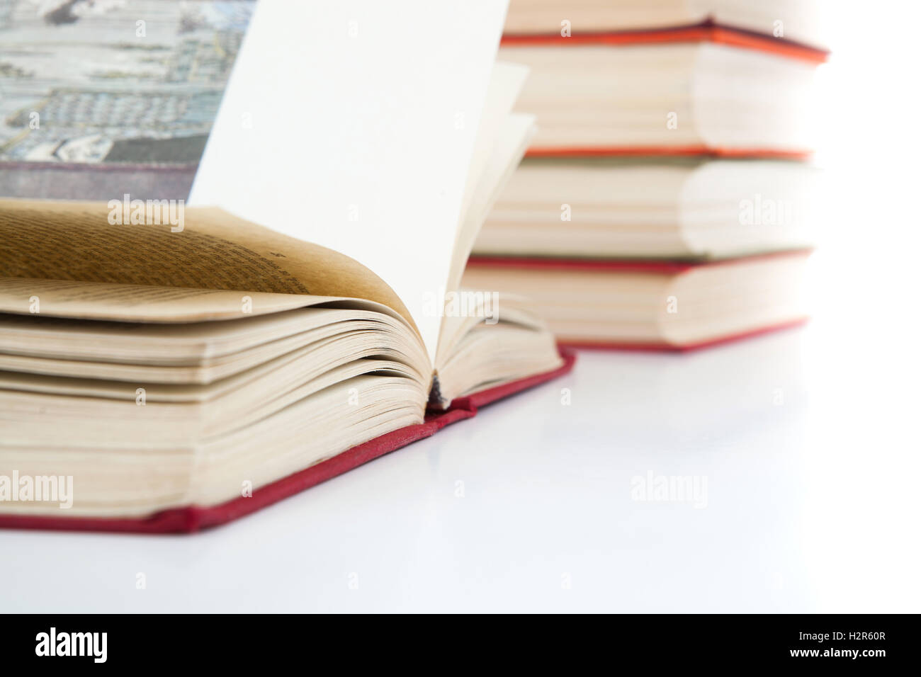 open books and stack of books on white Stock Photo - Alamy