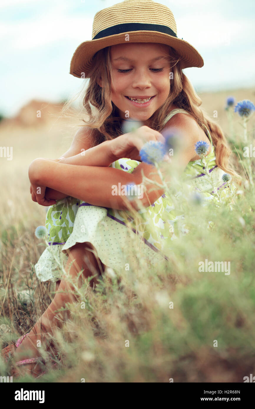 Girl in spring field Stock Photo - Alamy