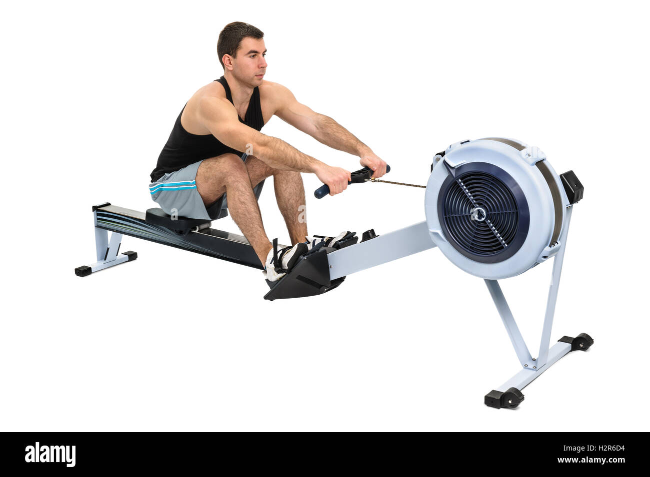 man doing indoor rowing Stock Photo - Alamy