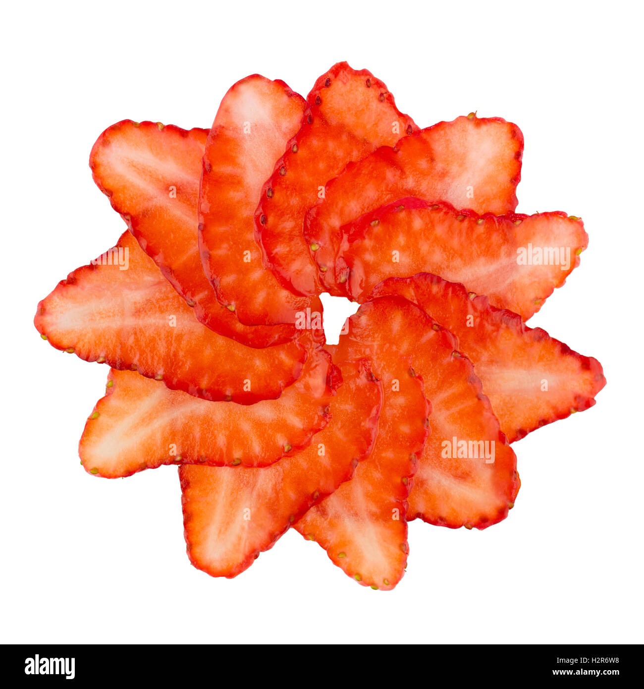 Strawberries sliced and arranged in spiral circle, isolated on white ...