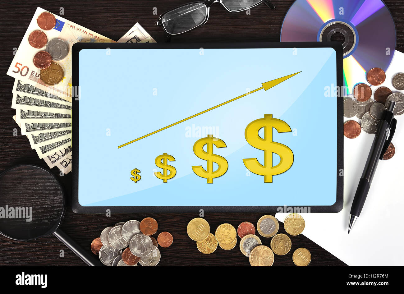 tablet with dollar chart Stock Photo - Alamy