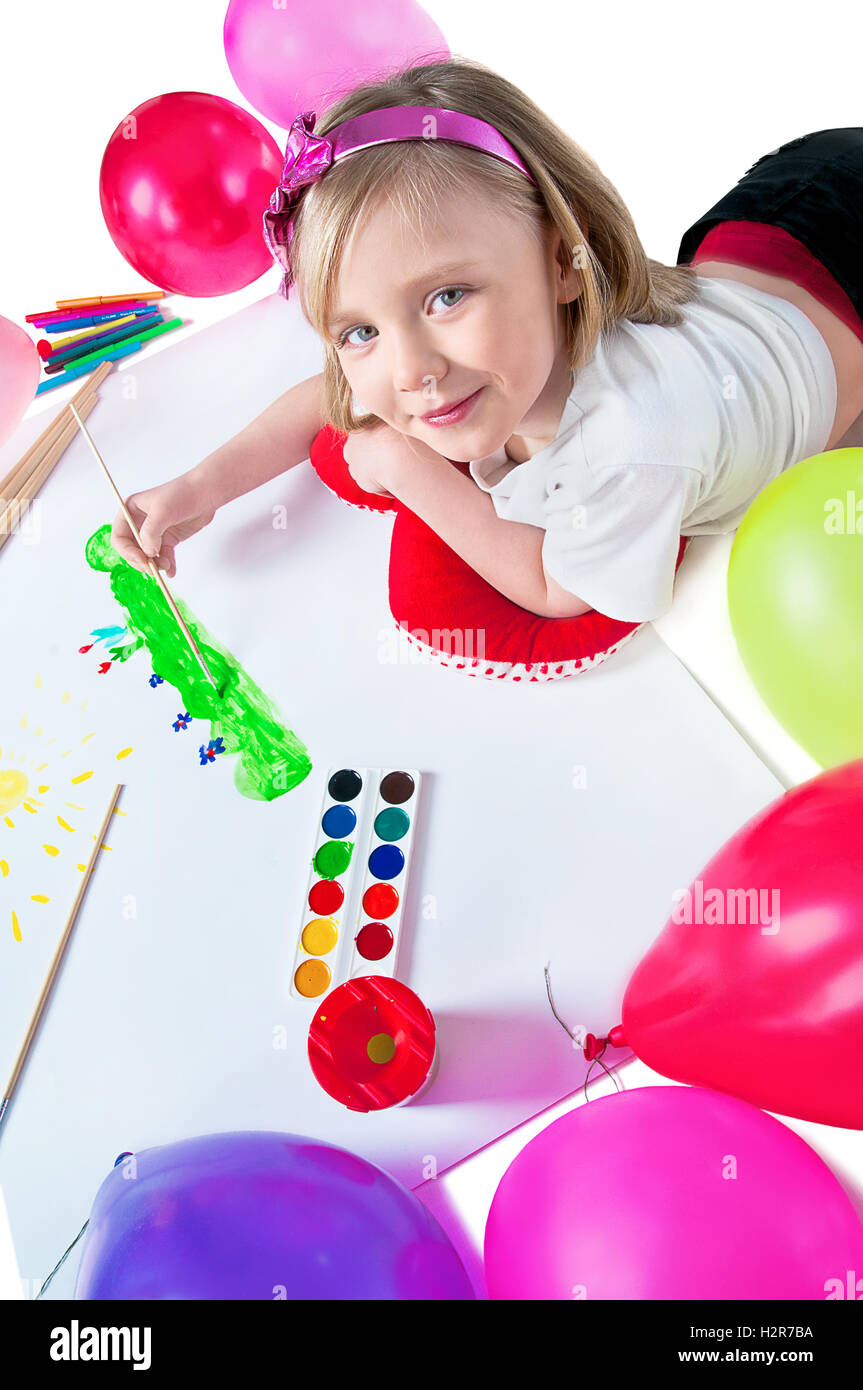 a girl is painting a picture Stock Photo - Alamy