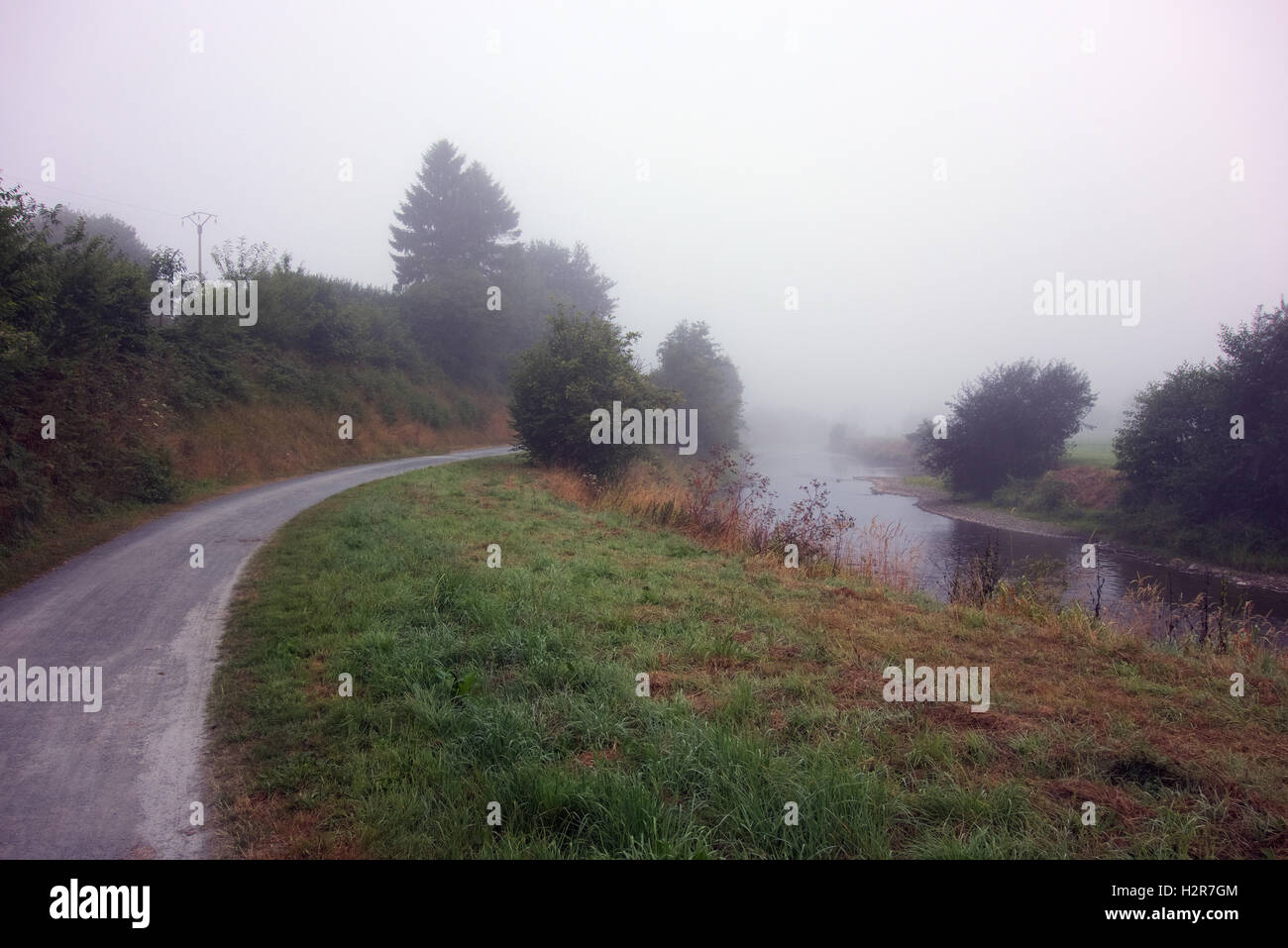 Voie Vert cycle track early summer morning alongside River Vire in ...