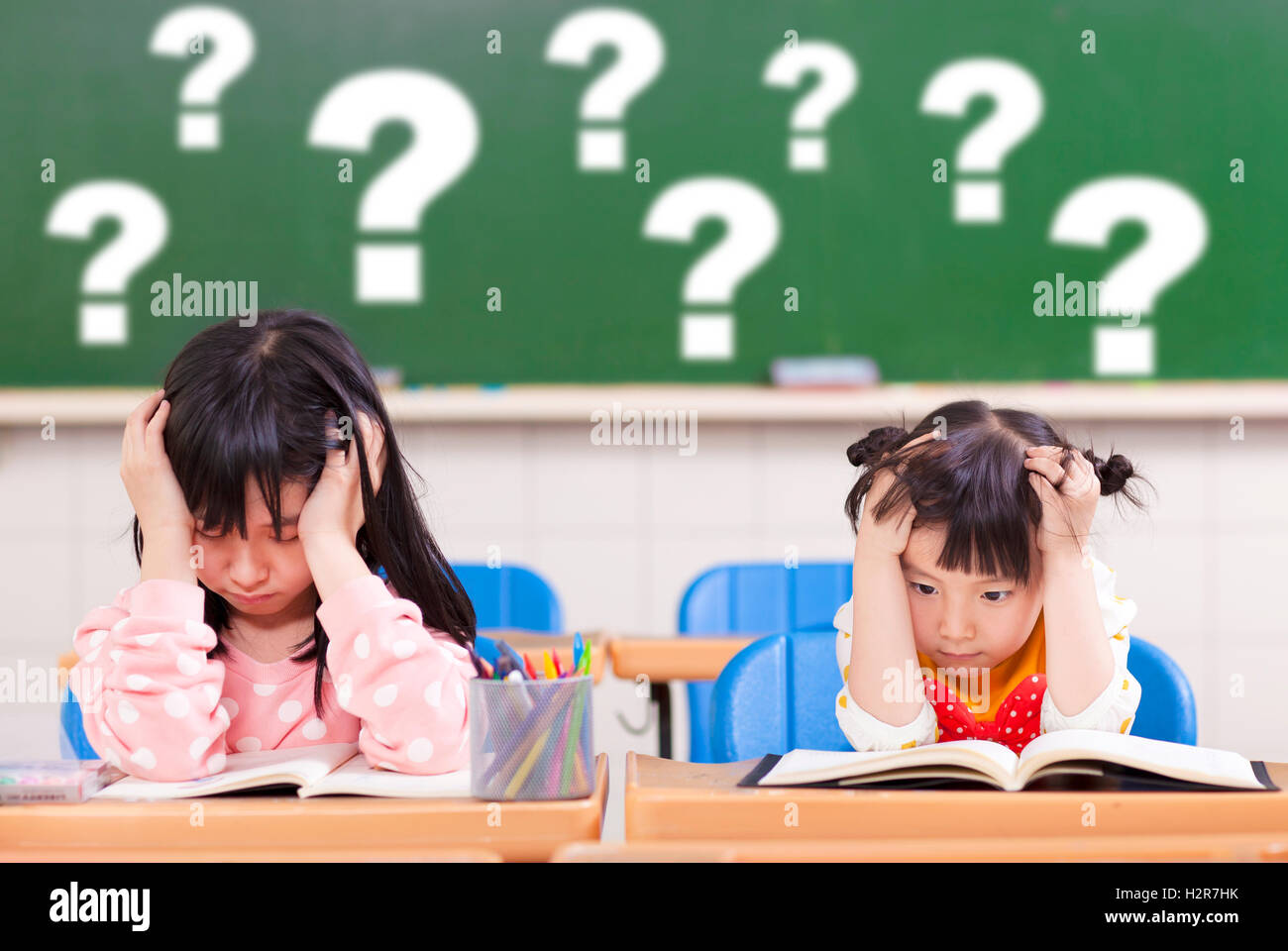 two kids is full of questions in class Stock Photo - Alamy