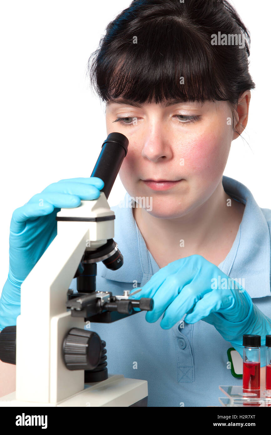 Girl working at the laboratory with microscope Stock Photo - Alamy